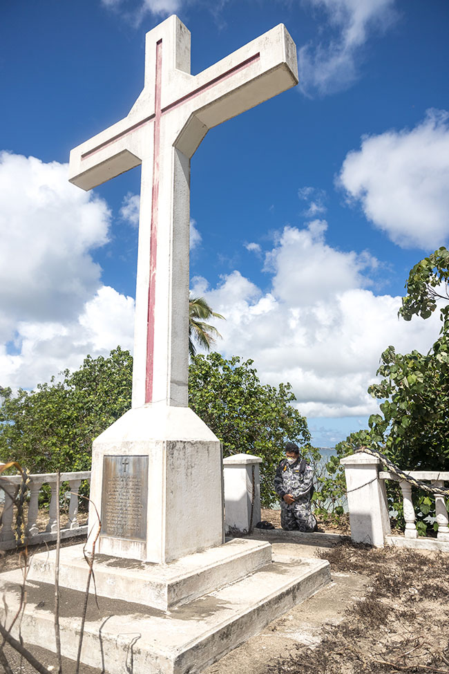 Special attention for white cross monument, during clean up at ...